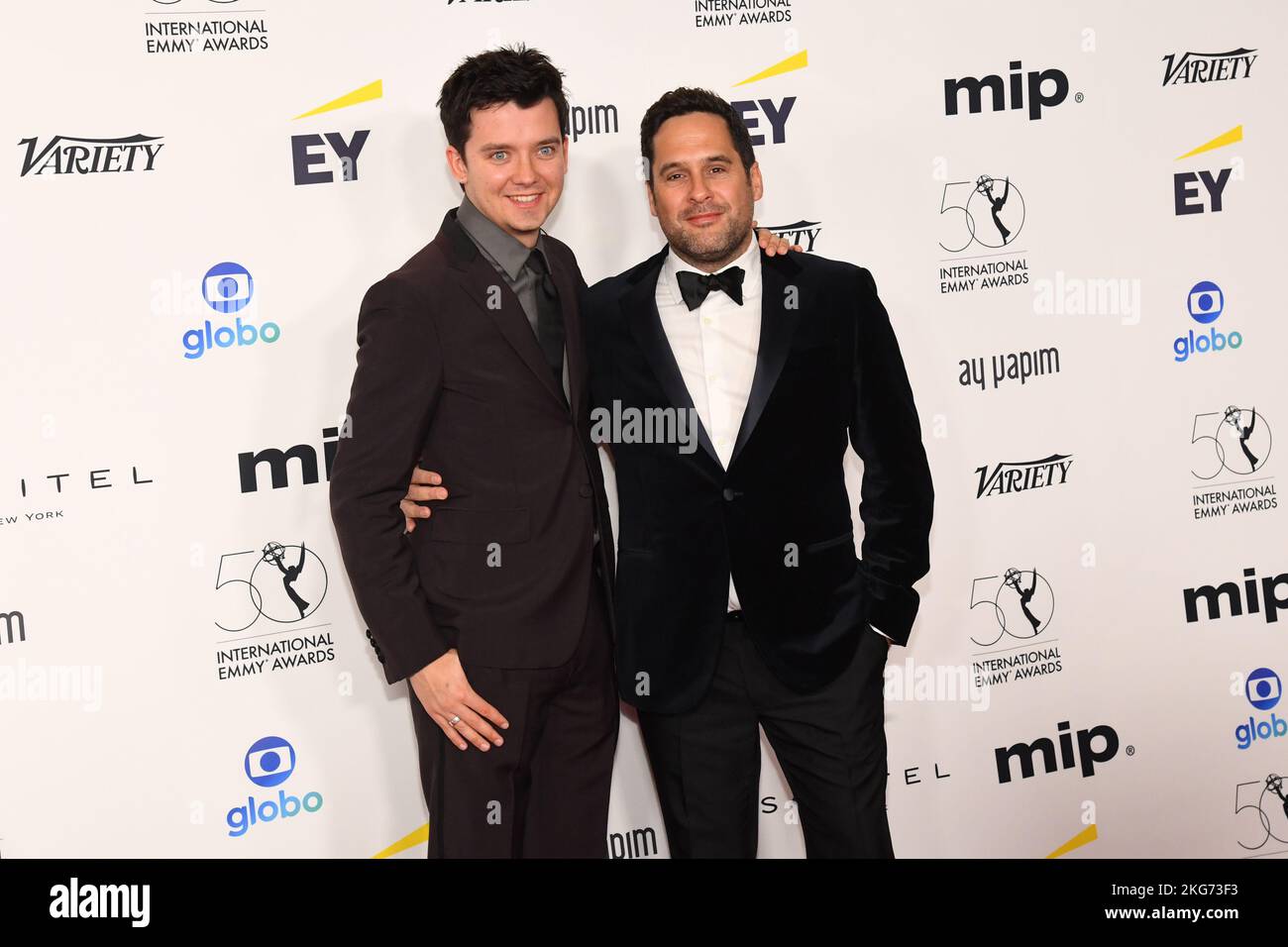 Jamie Campbell and Asa Butterfield, with team, walking the red carpet ...