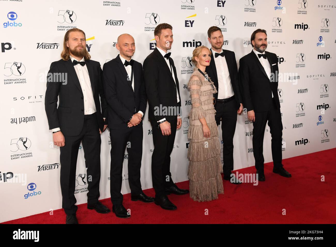 Mari Walther Svenning and Ole Petter Klepp, with team, walking the red ...
