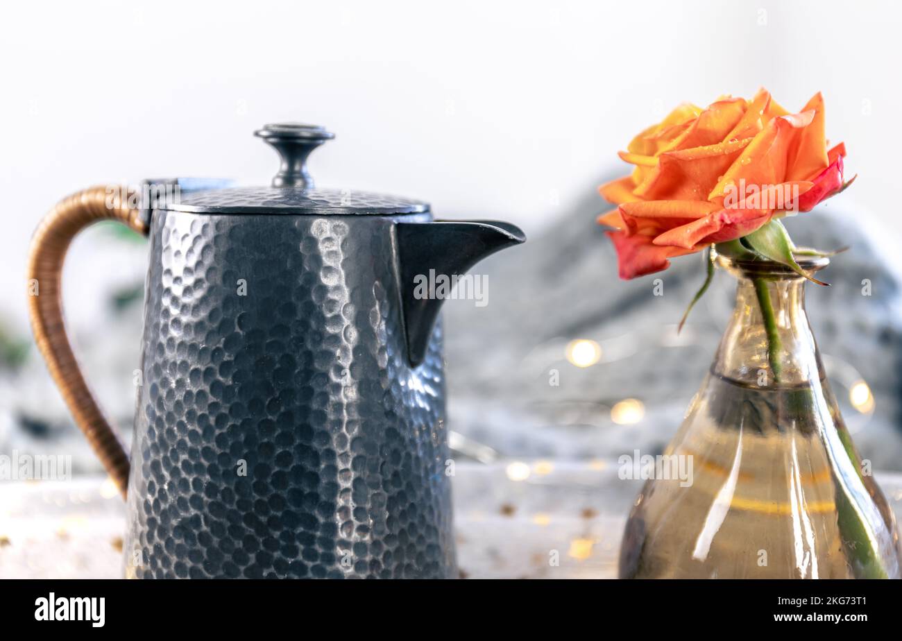 Beautiful textural teapot on a blurred background in a cozy home ...