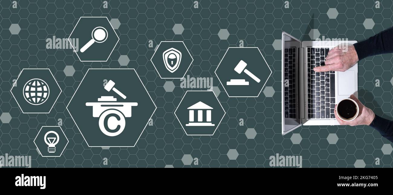 Top view of hands using laptop with symbol of copyright concept Stock ...