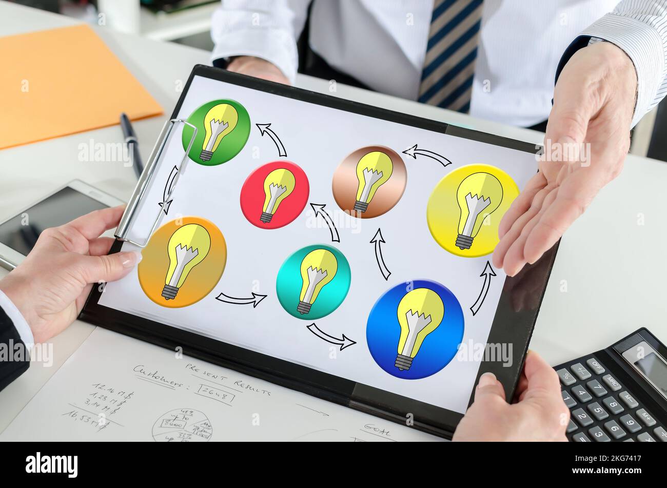 Ideas sharing concept shown by a businessman Stock Photo - Alamy