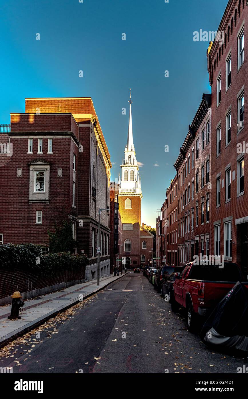 A vertical skyline of Boston downtown buildings along a road with ...