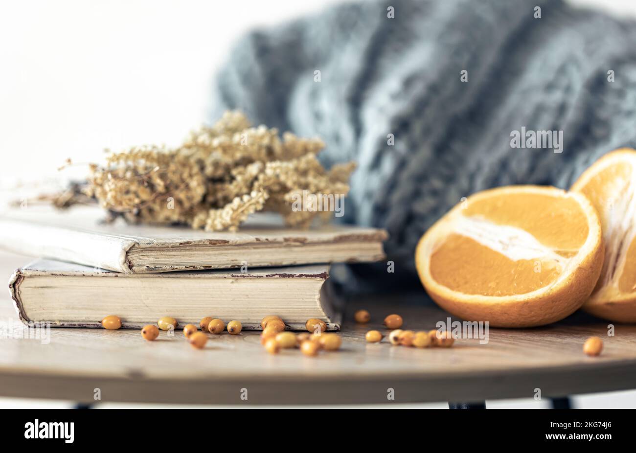 Cozy home composition with books on the table close-up Stock Photo - Alamy