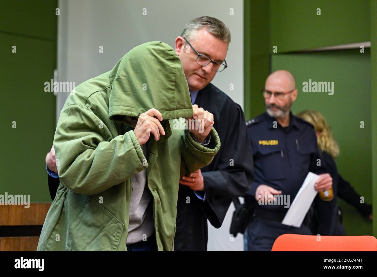 Munich, Germany. 22nd Nov, 2022. The defendant is led into the ...