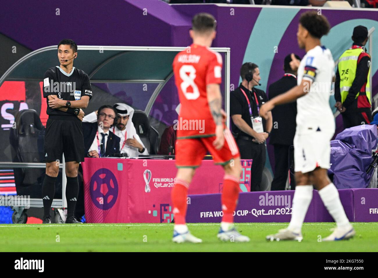 Chinese referee Ma Ning is serving as the fourth official in the 2022 ...