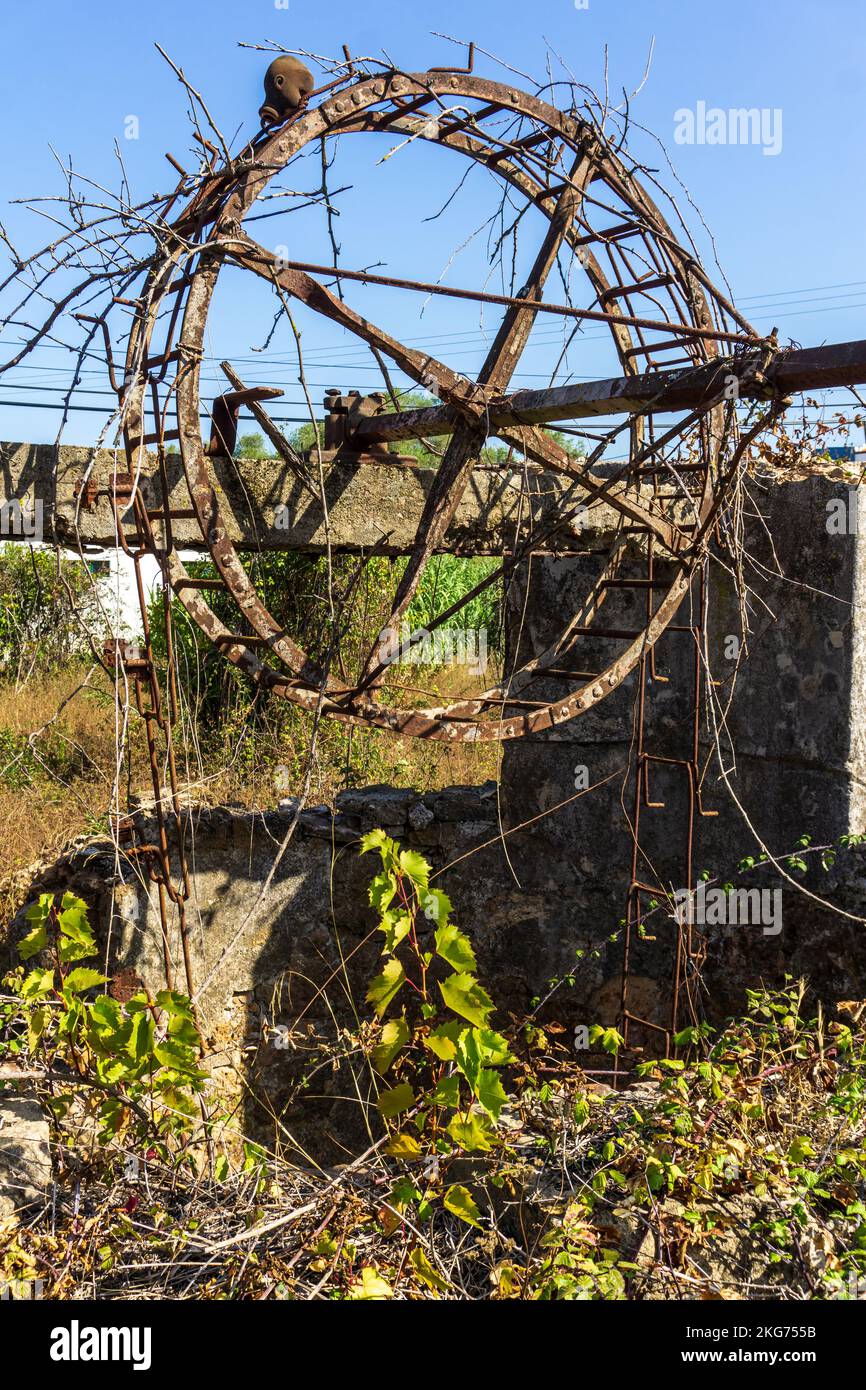 An old abandoned well with a scary doll head on it Stock Photo - Alamy