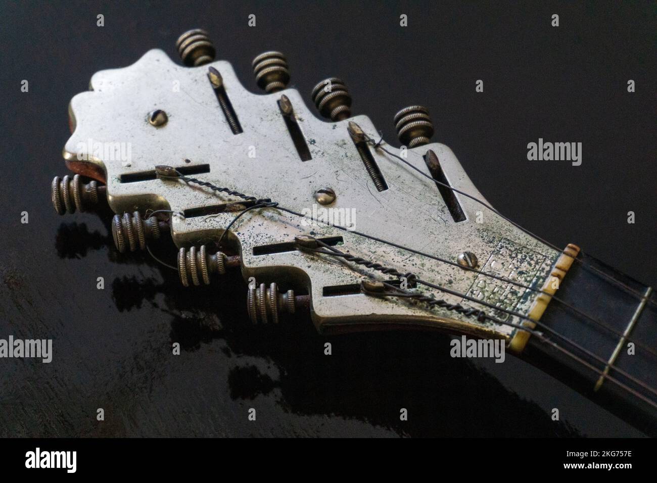 Metal neck of an old banjo instrument Stock Photo - Alamy