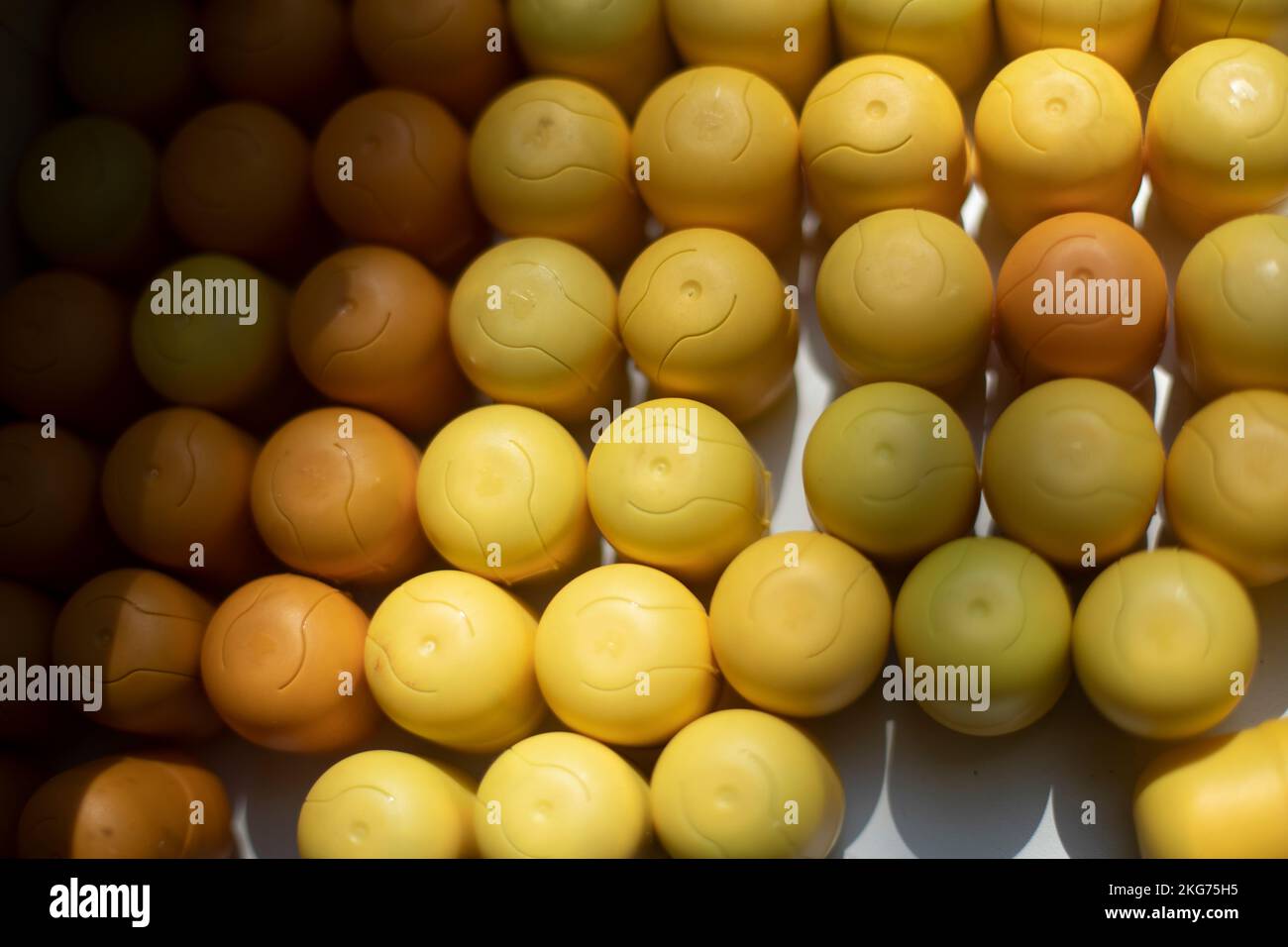 Yellow caps for toys. Yellow eggs. Yellow texture Stock Photo - Alamy