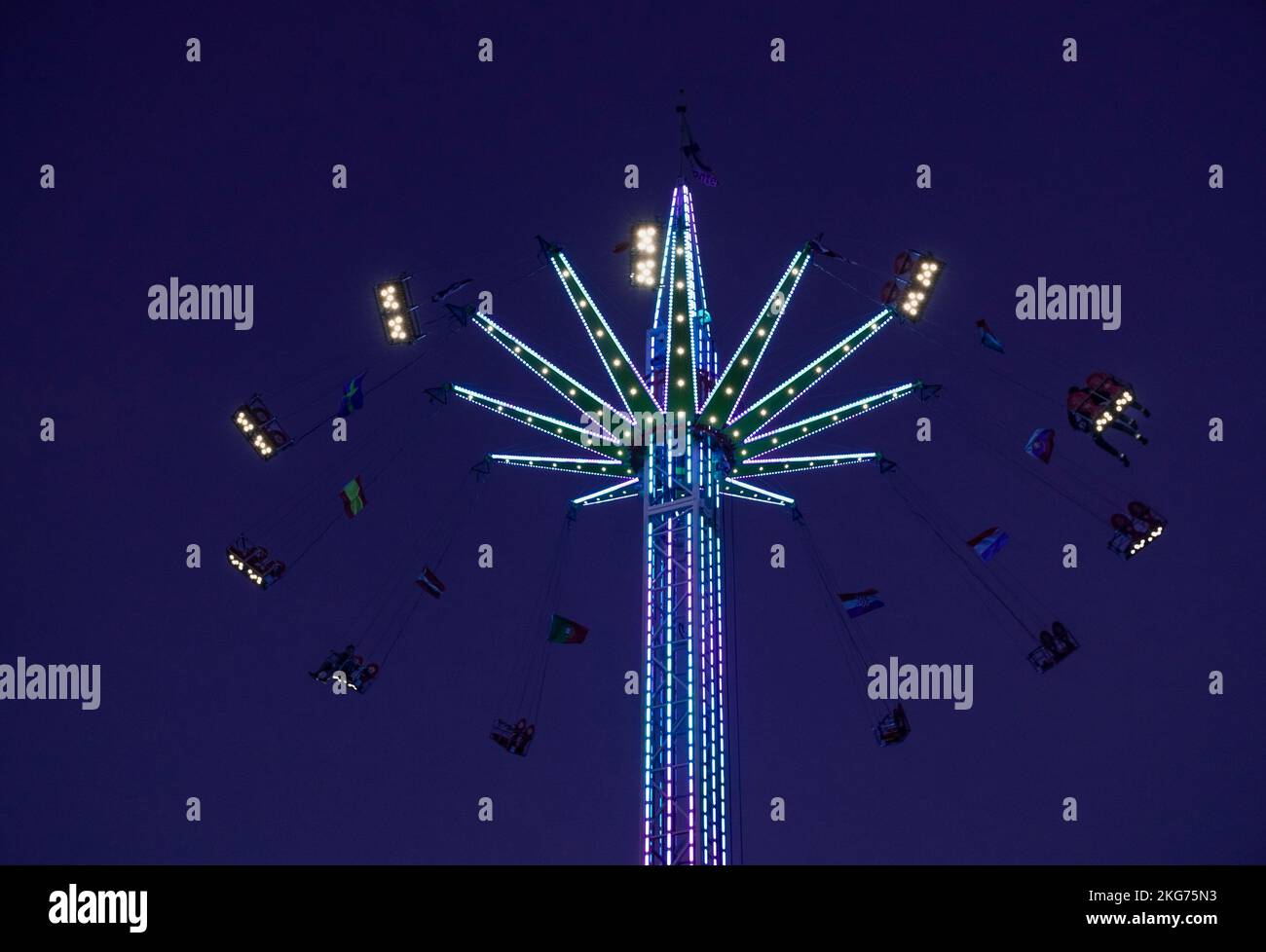 Colorful amusement Ride in the sky. Swings in a quiet park on an autumn ...