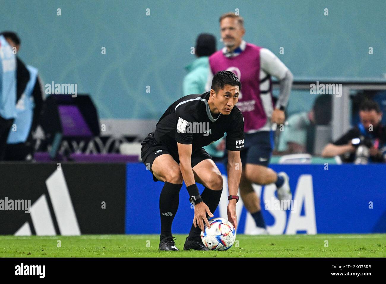 Chinese referee Ma Ning is serving as the fourth official in the 2022 ...