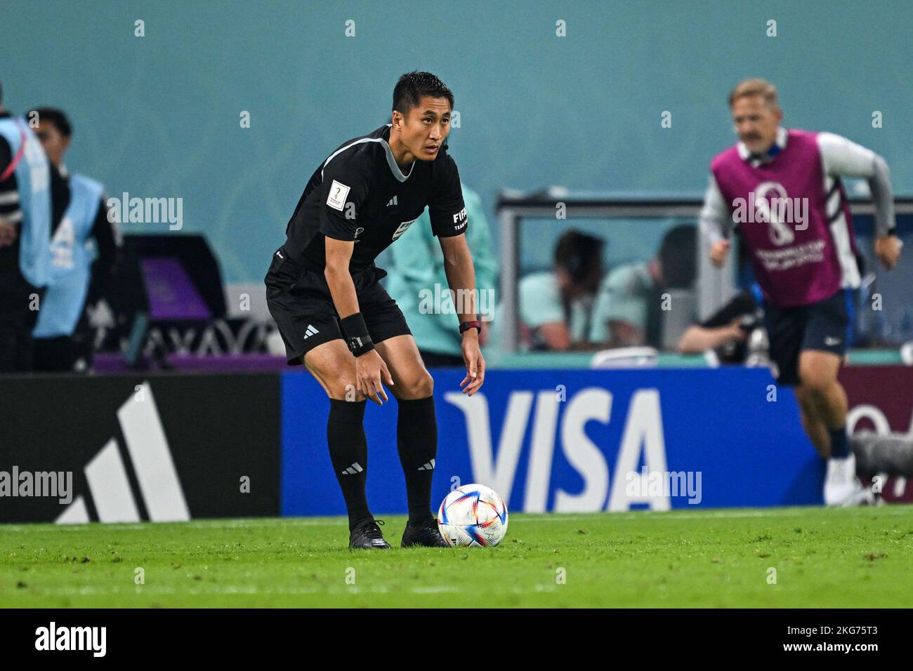 Chinese referee Ma Ning is serving as the fourth official in the 2022 ...