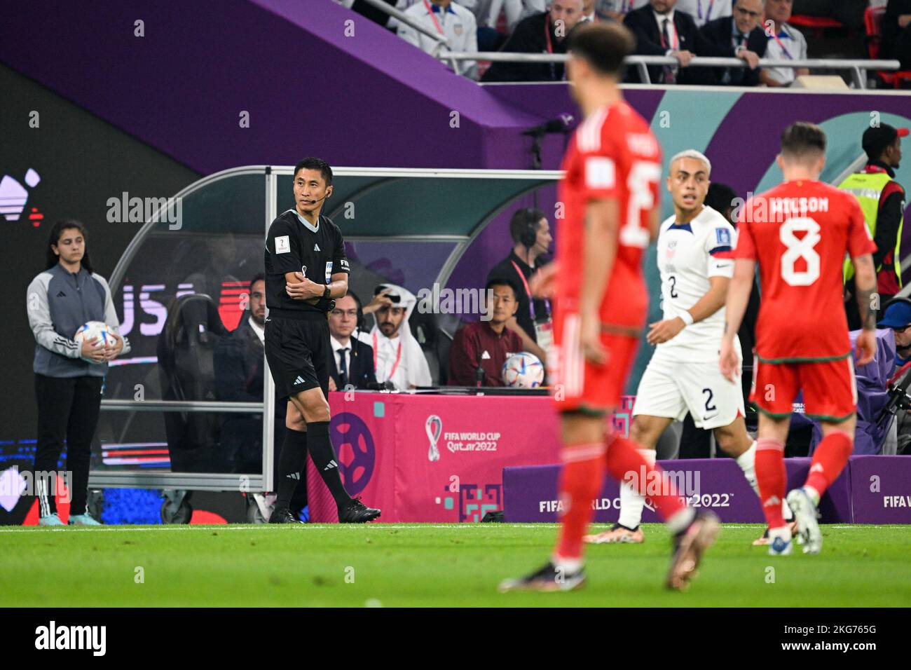 Chinese referee Ma Ning is serving as the fourth official in the 2022 ...