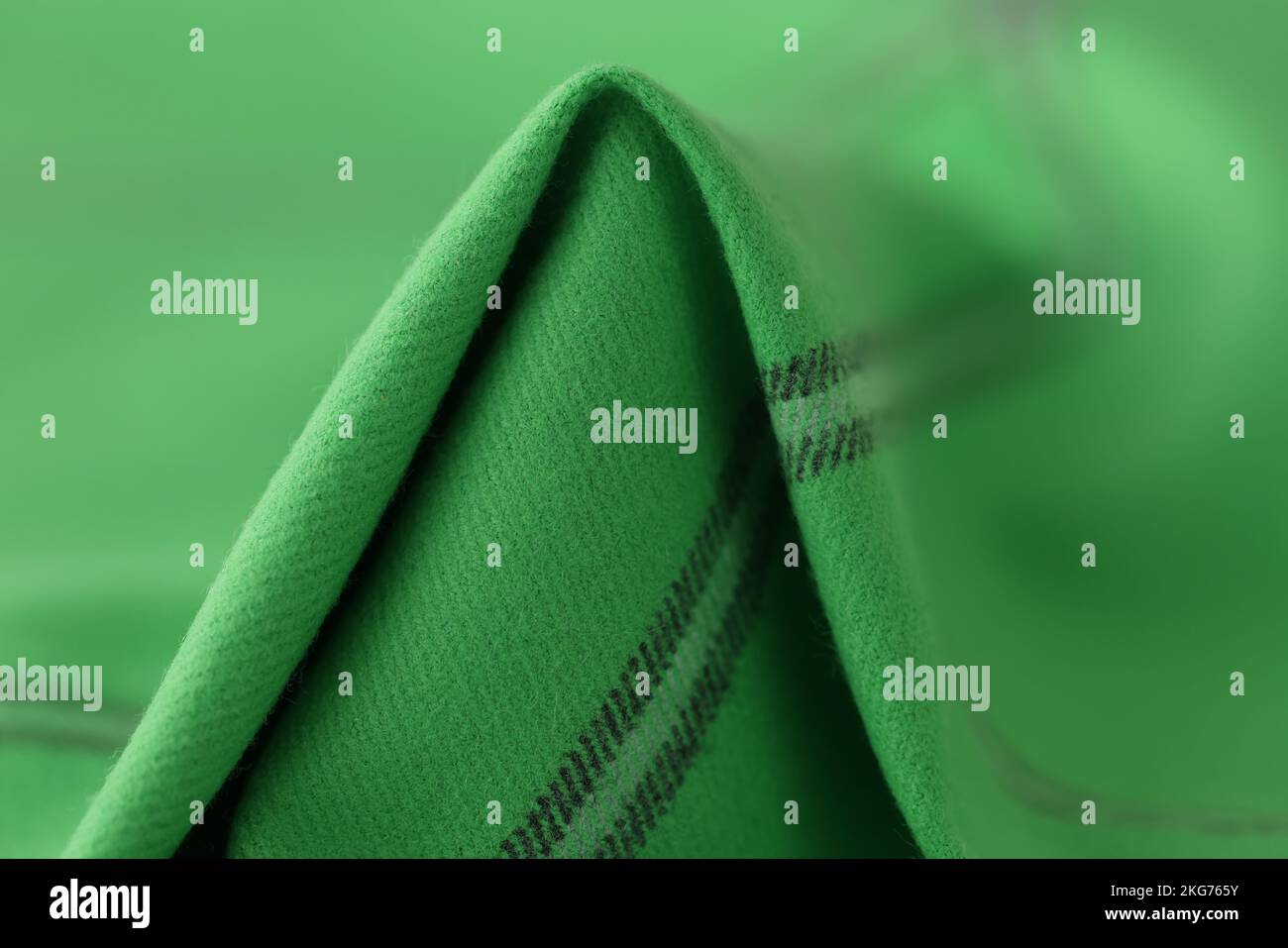Green woolen fabric with black lines, textile cloth texture background ...
