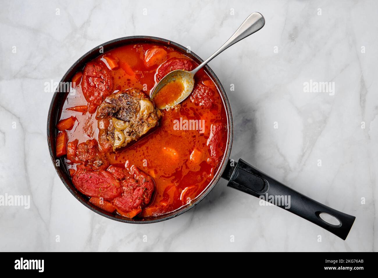 Slow cooking food. Bottom round roast beef meat stew with tomatoes and ...