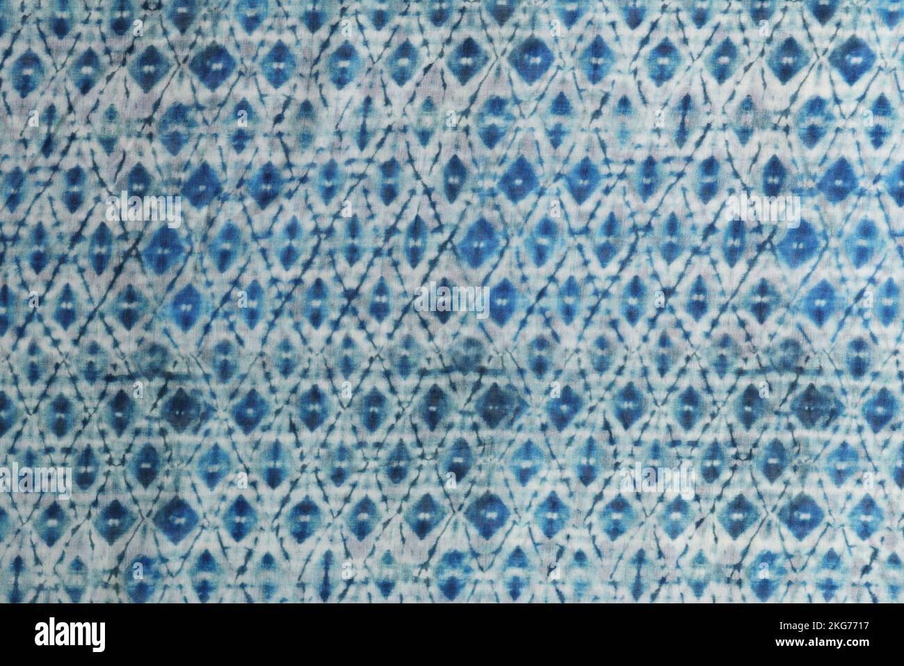 Wavy blue fabric with geometric print for sewing Stock Photo - Alamy