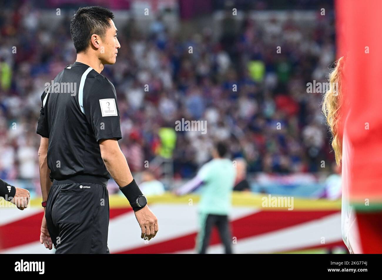 Chinese referee Ma Ning is serving as the fourth official in the 2022 ...