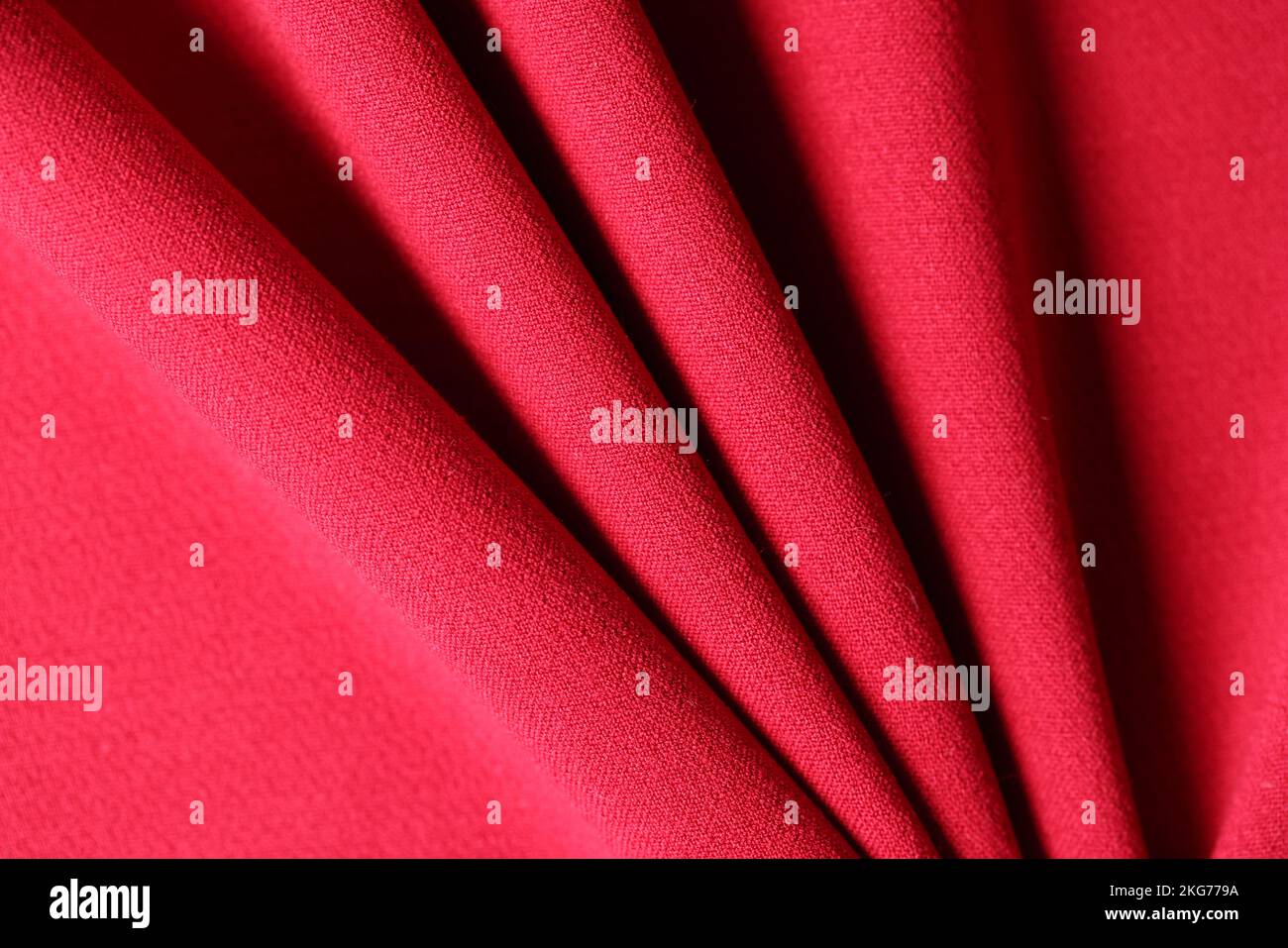 Soft folded bright red textile material textured background Stock Photo ...
