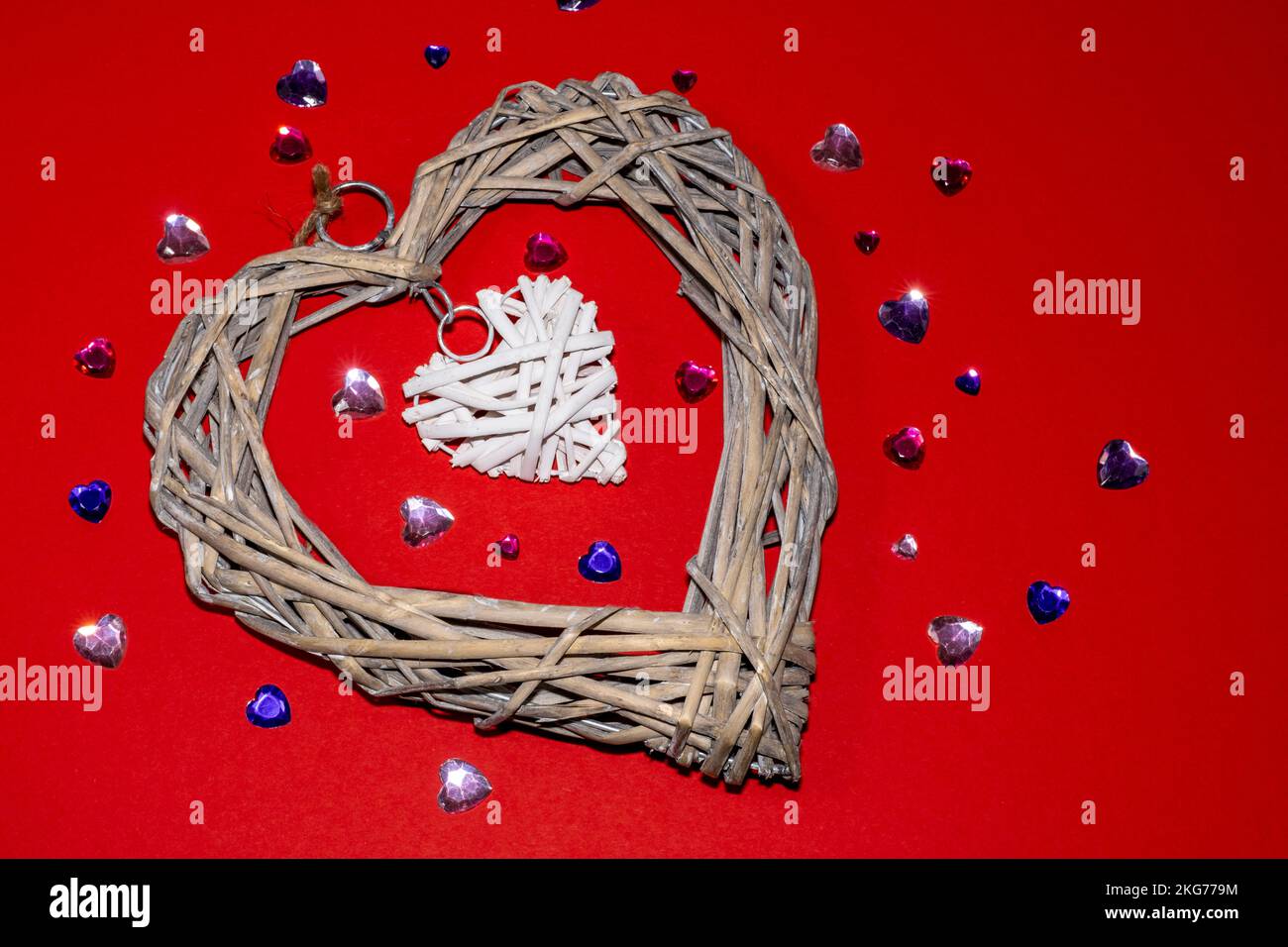 Straw heart figure on red background, love and romance icons, valentine ...