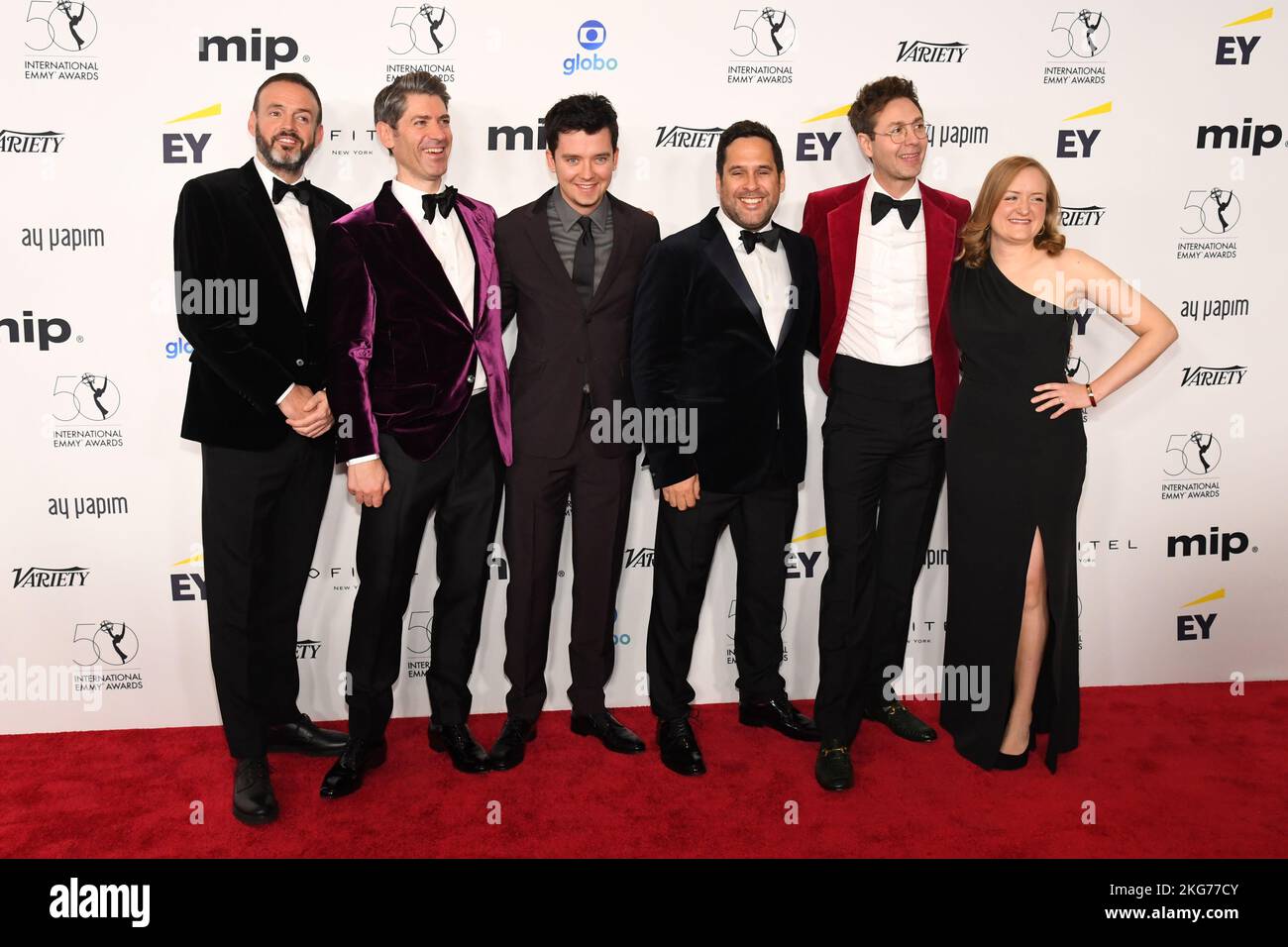 Jamie Campbell and Asa Butterfield, with team, walking the red carpet ...