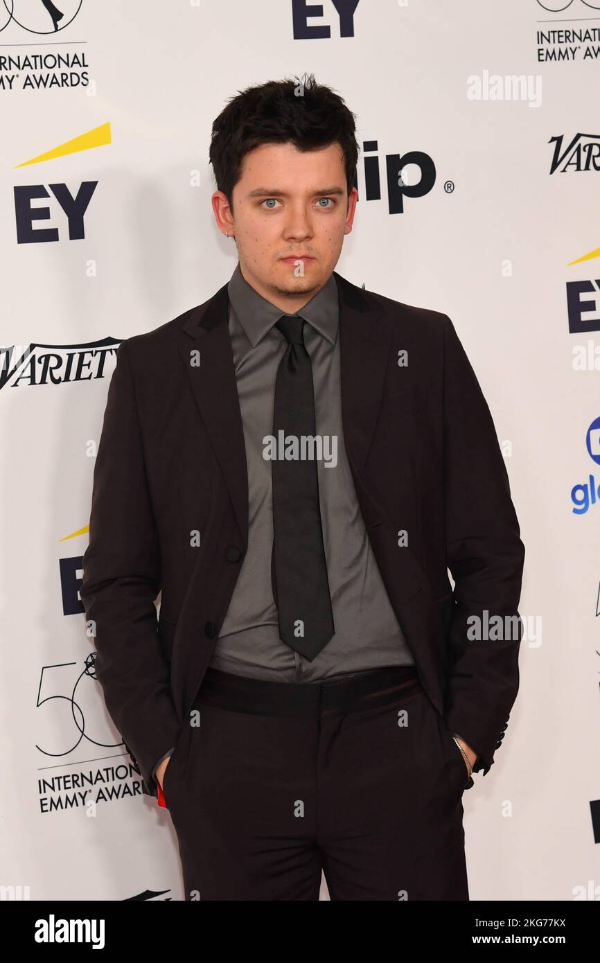 Asa Butterfield walking the red carpet at the International Emmy Awards ...