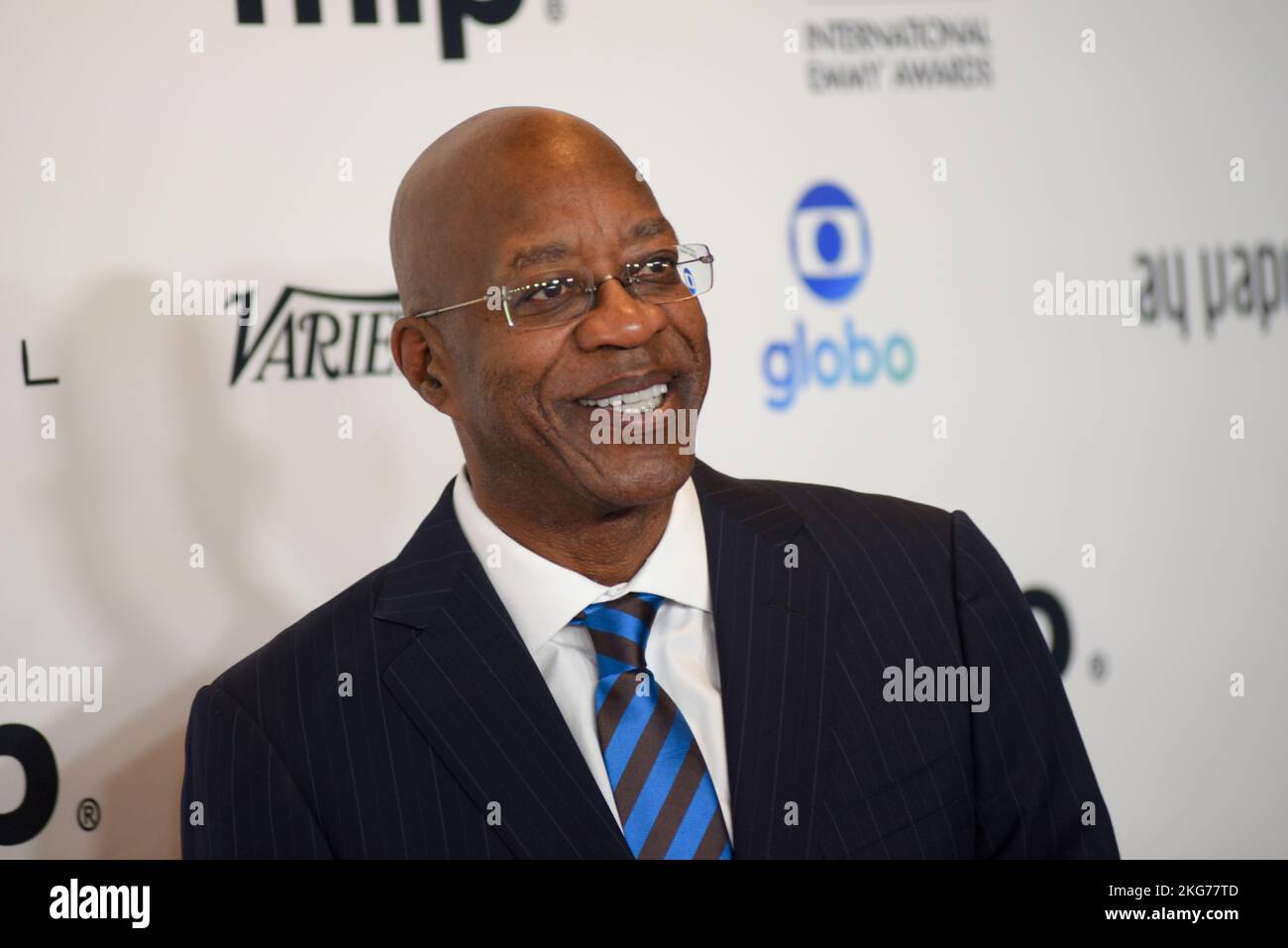 Dr. Edwin Moses walking the red carpet at the International Emmy Awards ...