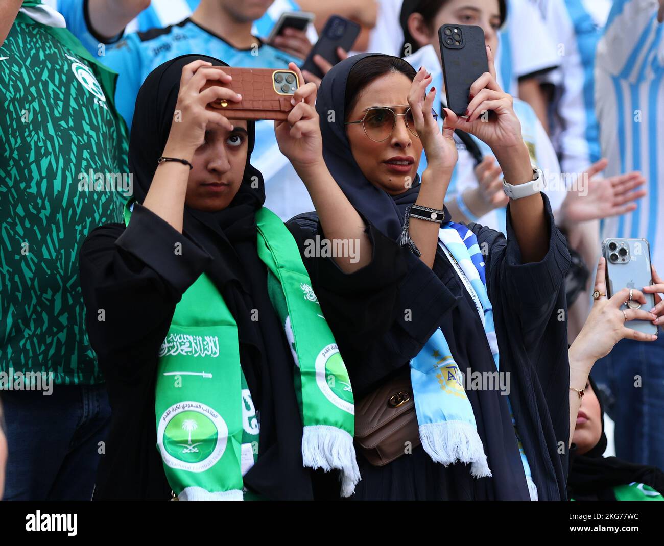 Doha, Qatar. 22nd Nov, 2022. Women fans take pictures with their phones ...