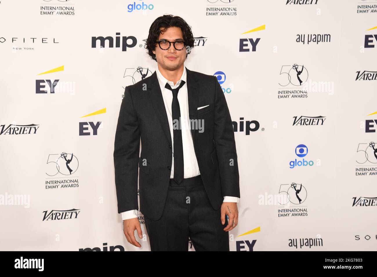 Charles Melton walking the red carpet at the International Emmy Awards ...