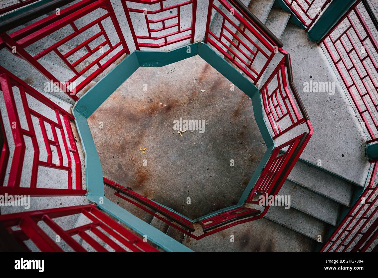 A top view of an outdoor spiral staircase with beautiful decorative red ...