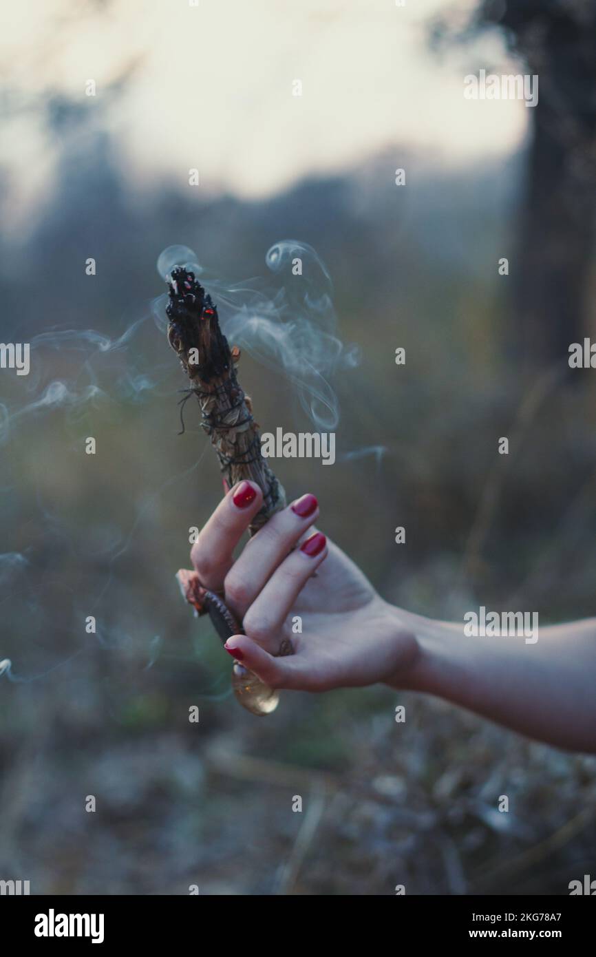 Close up smudging stick and smoke concept photo Stock Photo - Alamy