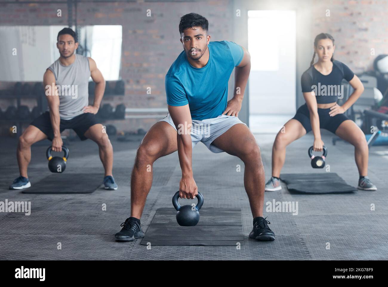 Fitness, kettlebell weight and people doing an exercise for strength ...