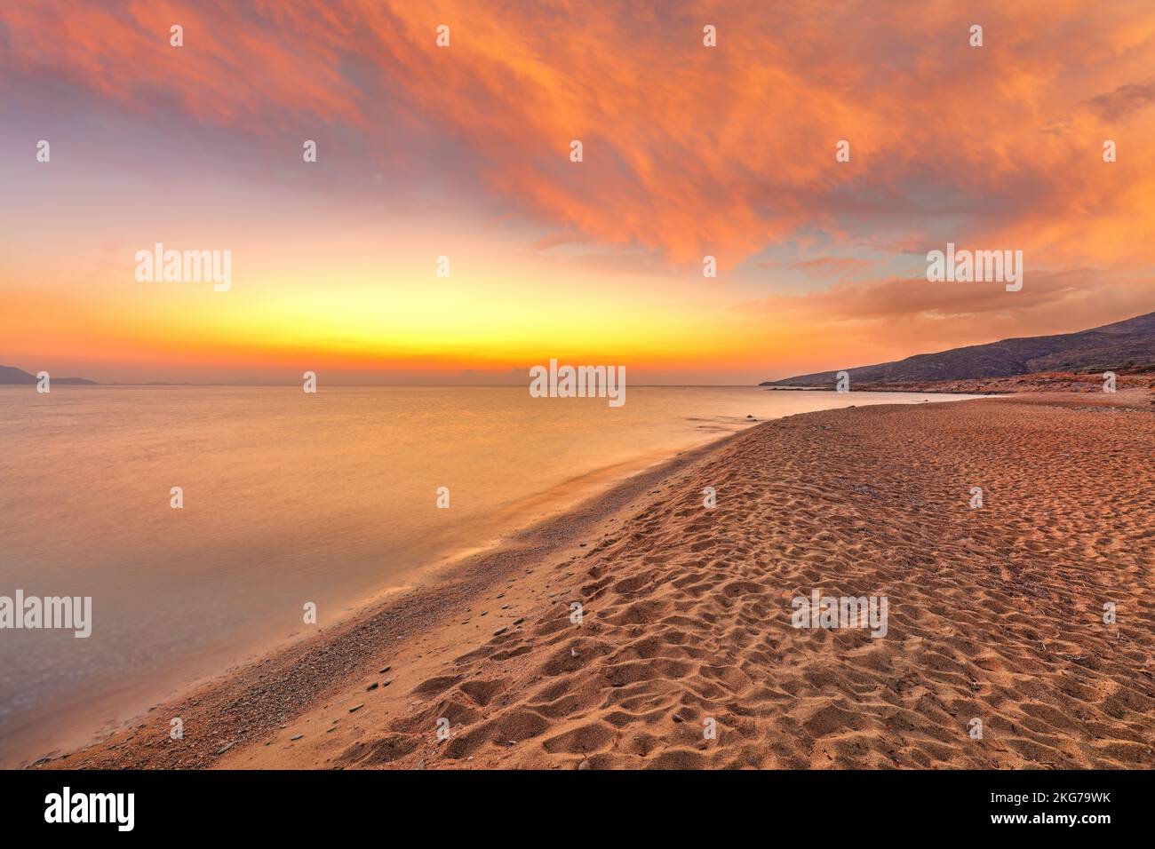 The sunrise from the sandy beach Psathi in Ios island, Greece Stock ...
