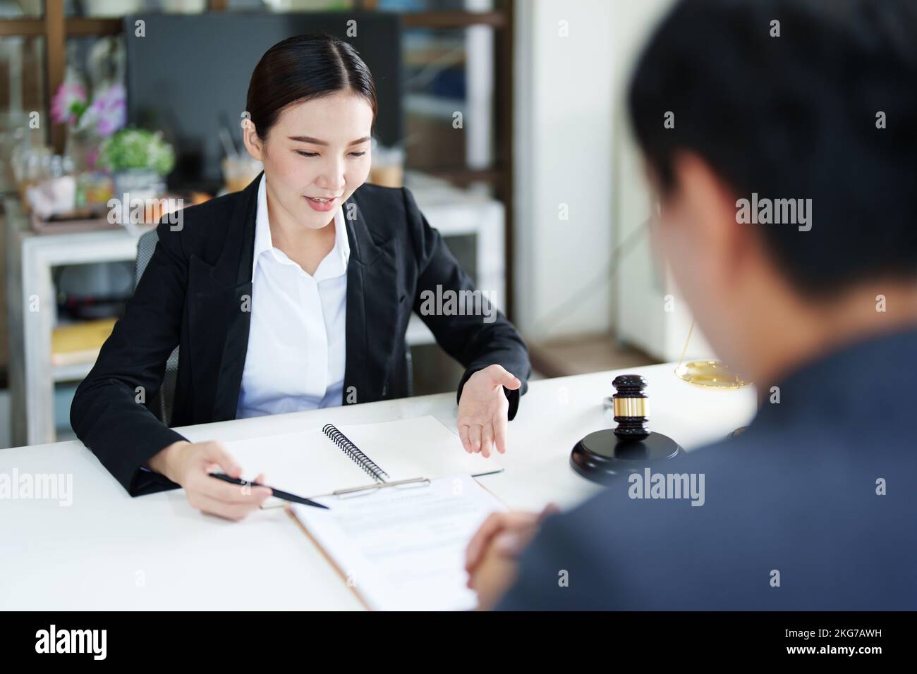 The signing of important documents between the lawyer and the client to ...