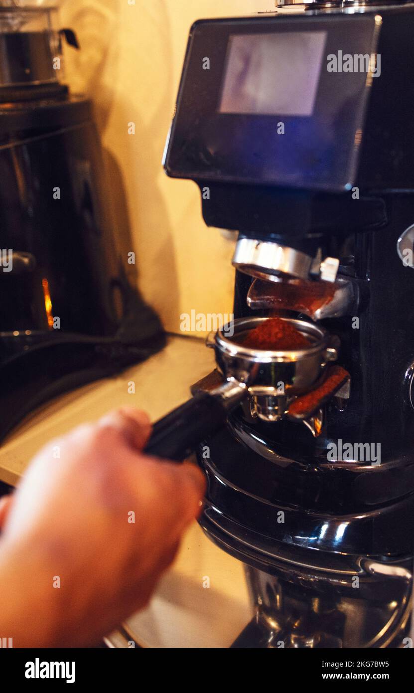 Coffee Grinding process, barista hand hold grinding fresh roasted ...
