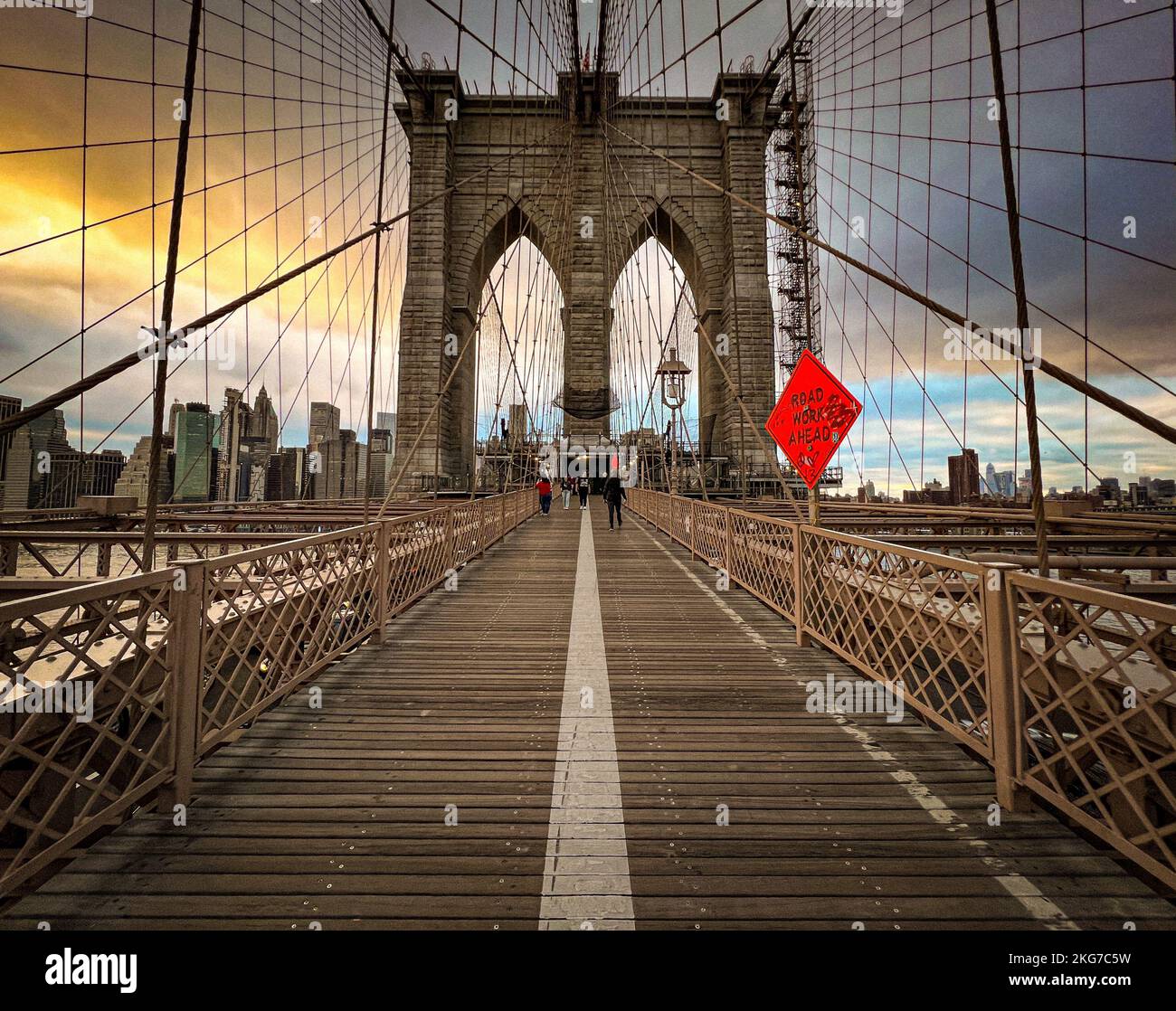 Brooklin bridge in new york city (NYC), cloudy at the sunset and ...