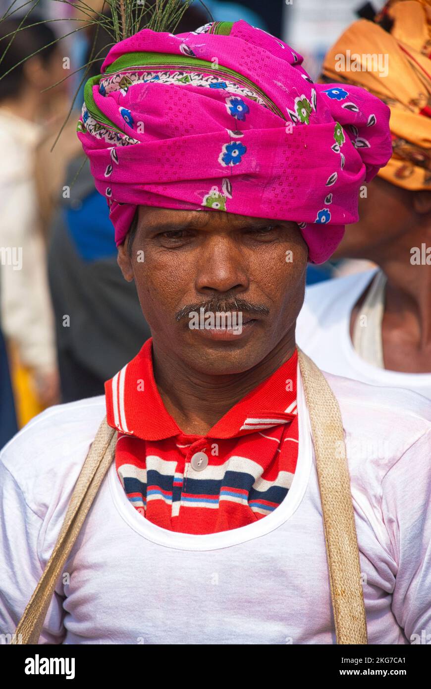 A vertical shot of an Indian male with a turban looking at the camera ...
