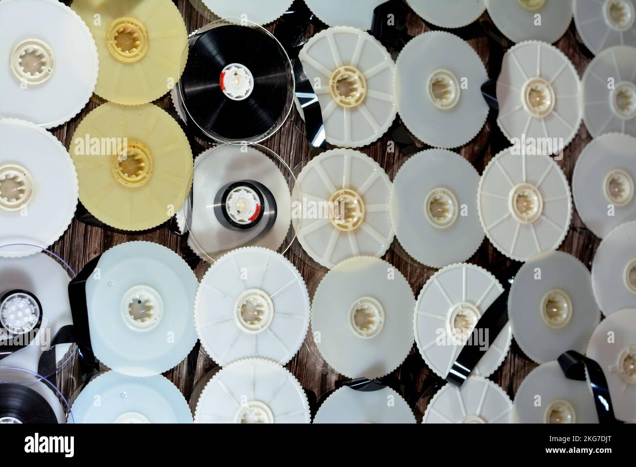 Stack of supply and take up reels with ribbon of VHS video cassette ...