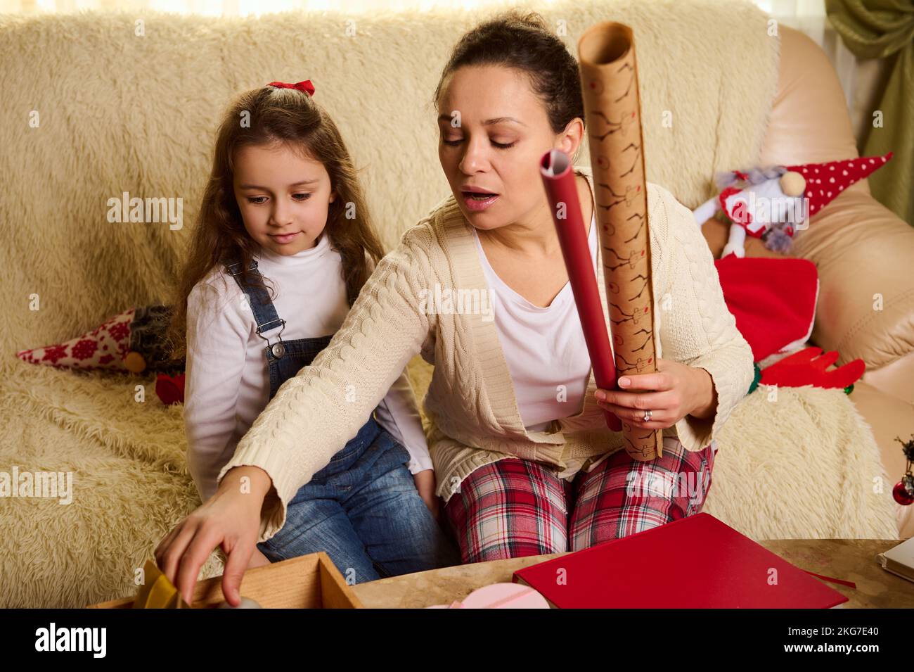 Loving mom and daughter enjoy upcoming winter holidays, packing ...