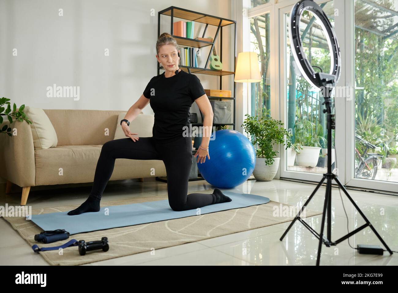 Online fitness instructor explaining how to do exercise Stock Photo - Alamy