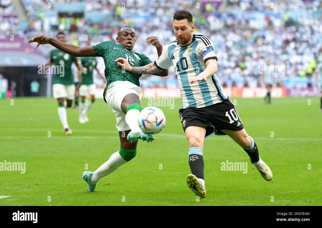 Saudi Arabia's Saud Abdulhamid (left) and Argentina's Lionel Messi ...