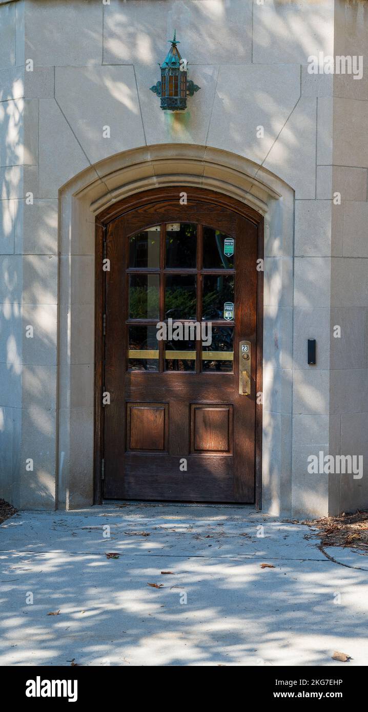 Doorway for a college dormitory with a wood door gothic style building ...