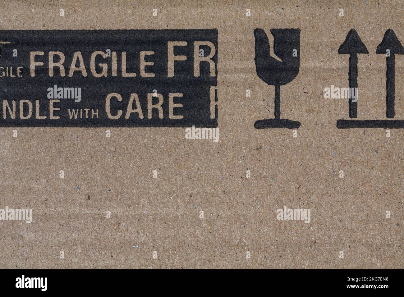 fragile handle with care and arrows pointing upwards stamped on box ...