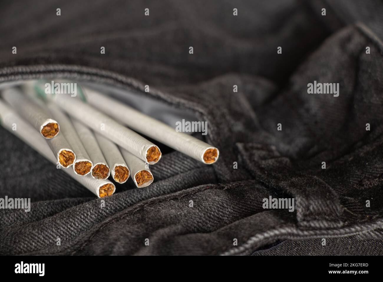cigarettes in a pocket in gray jeans, cigarette addiction and fashion ...