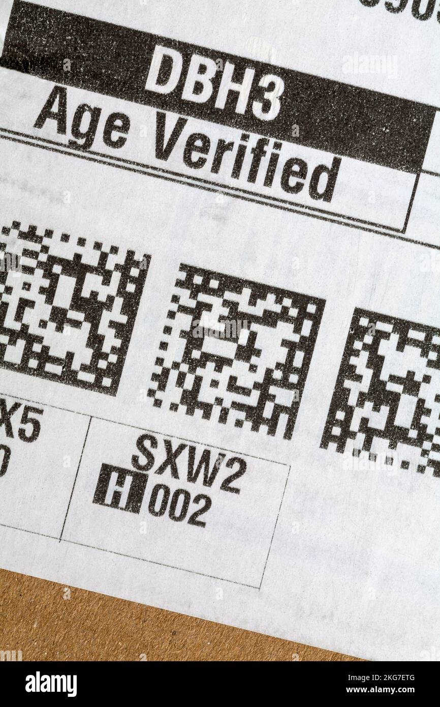 Age verified detail on packaging parcel containing alcohol with qr code ...