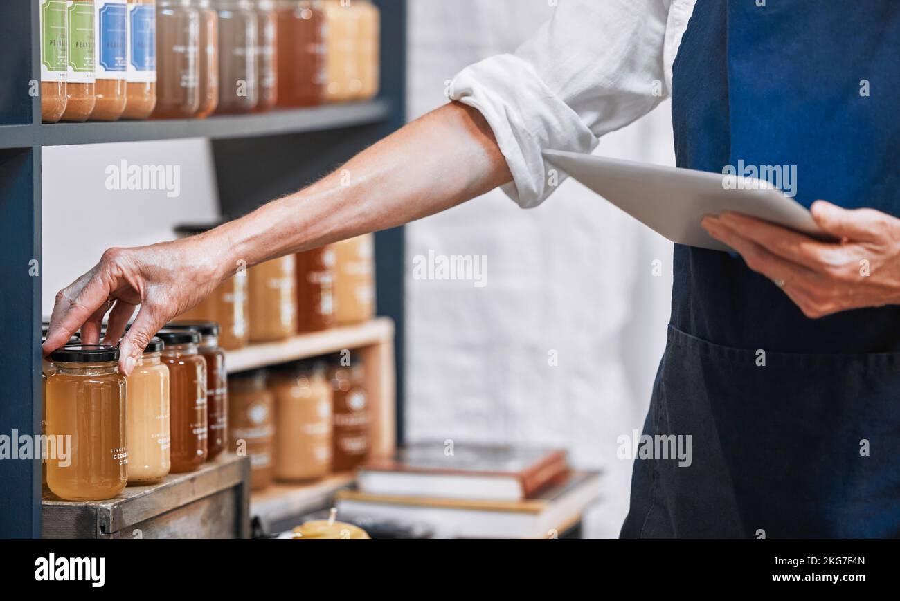 Hands, tablet and honey jar for inventory check, inspection or pricing ...