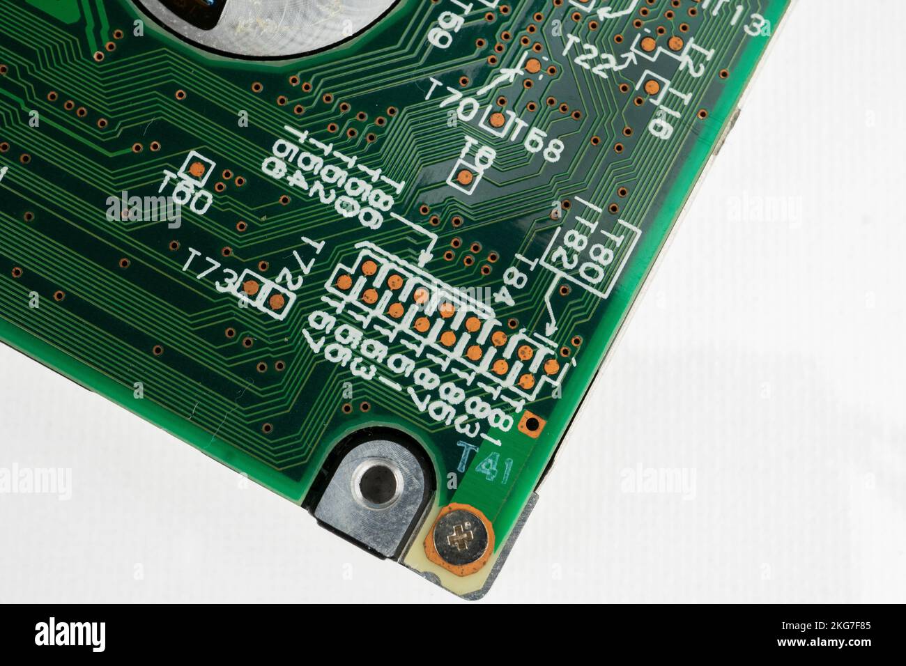 A closeup of a computer motherboard showing complicated circuits on ...