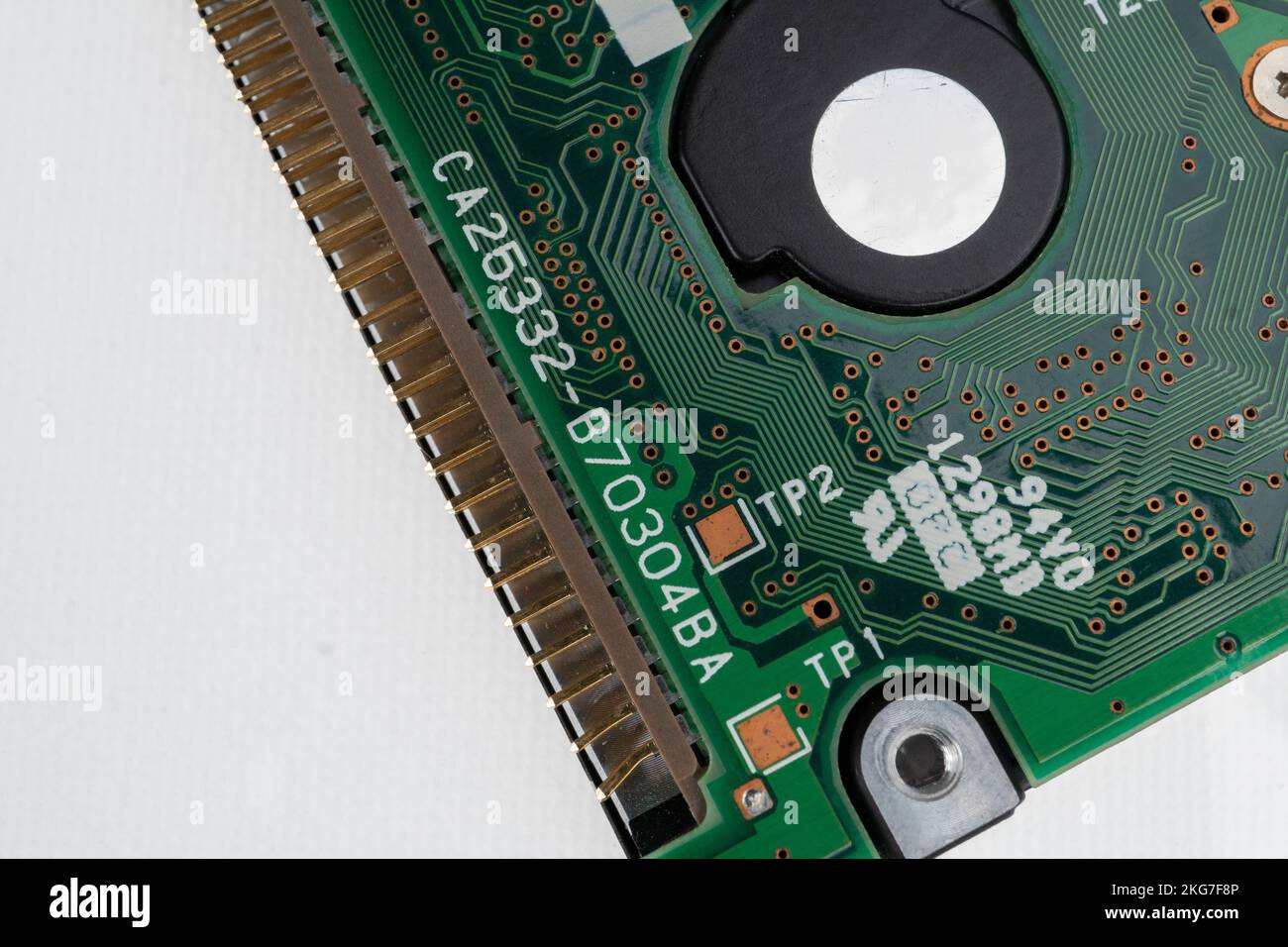 A closeup of a computer motherboard showing complicated circuits on ...