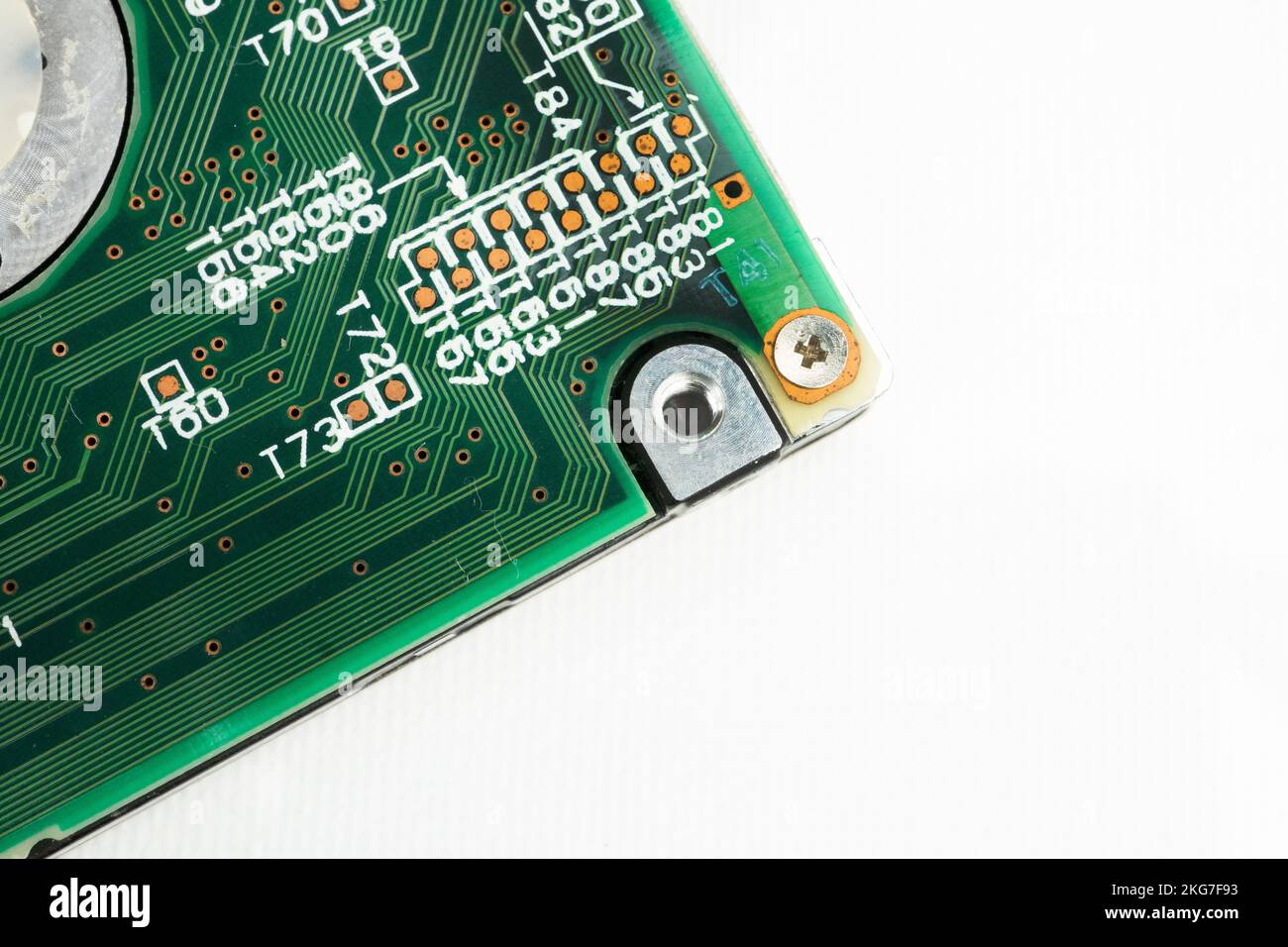 A closeup of a computer motherboard showing complicated circuits on ...