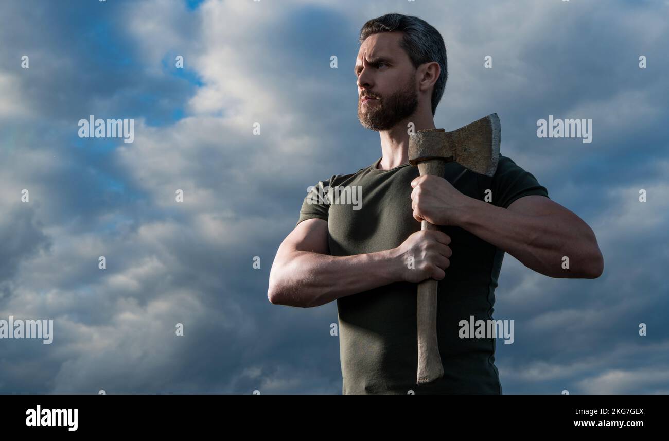 strong man with axe. woodman man hold ax. brutal man on sky background ...