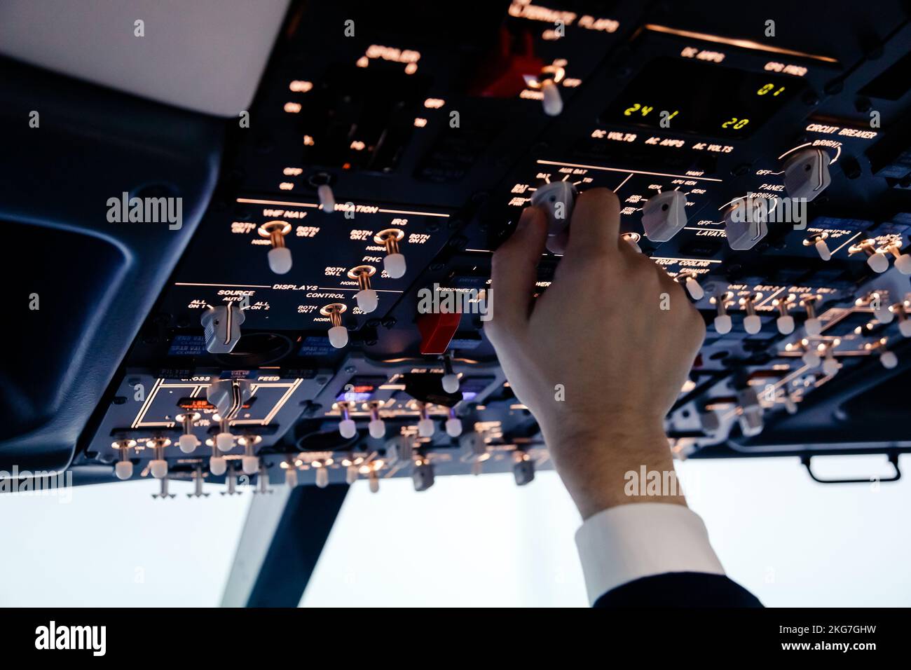 Pilot hand is controlling plane toggle switches to fly take off and ...