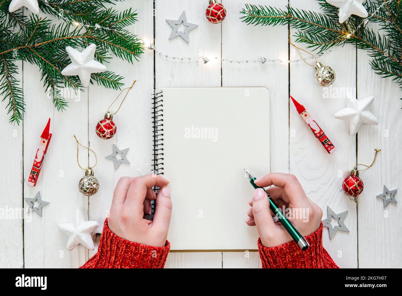 Christmas background with notepad and decor details on a white ...